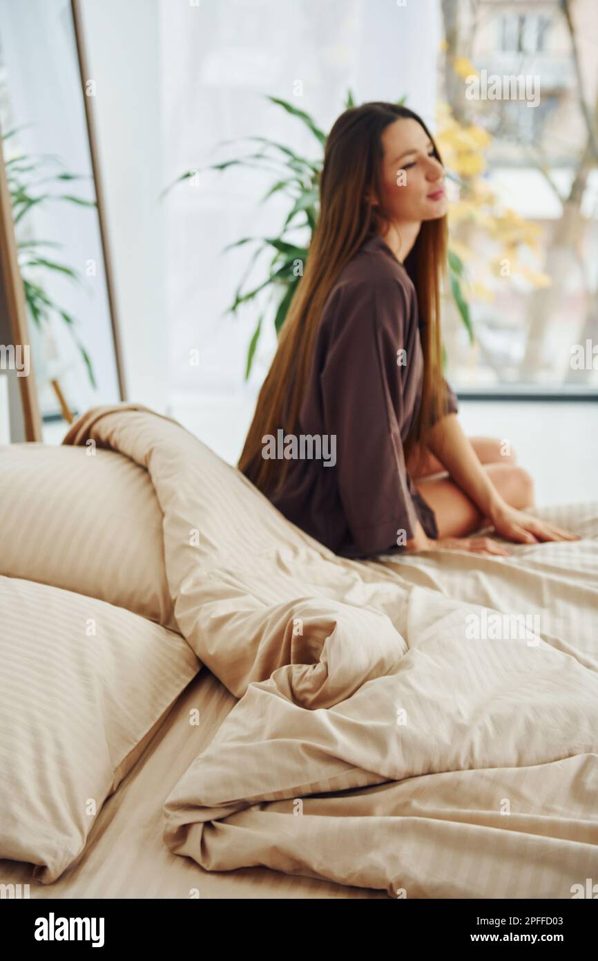 Woman have a rest. Interior and design of beautiful modern bedroom at ...