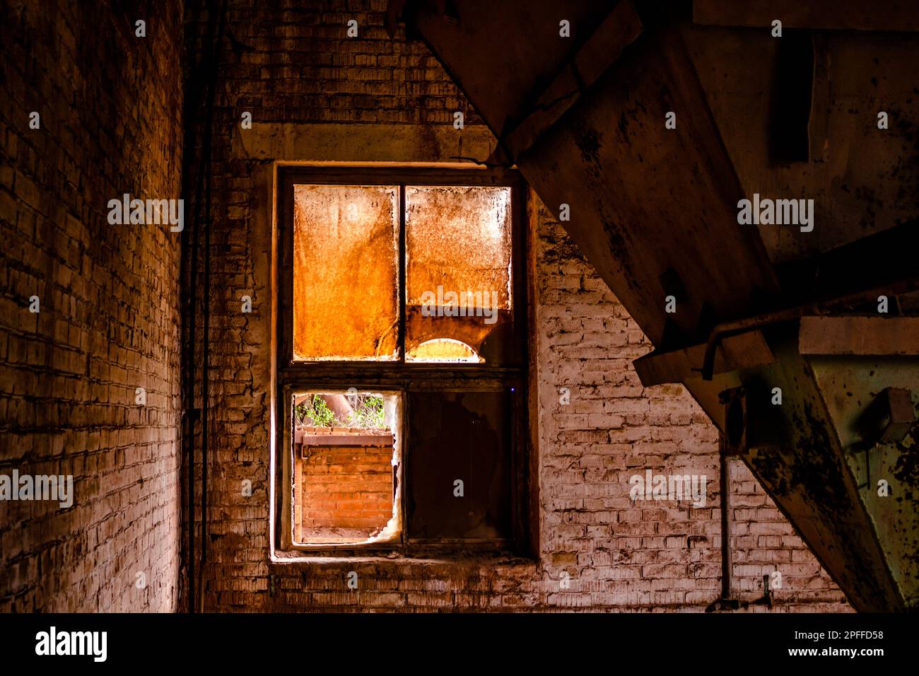 The window of an abandoned industrial factory Stock Photo - Alamy