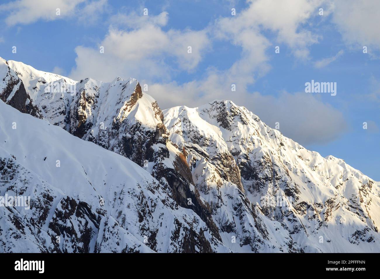 Snow-covered mountain peaks in Himalaya India. The Great Himalayas or ...