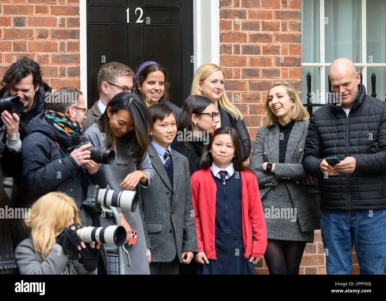 Jeremy Hunt's family look on as he and the treasury team pose for ...