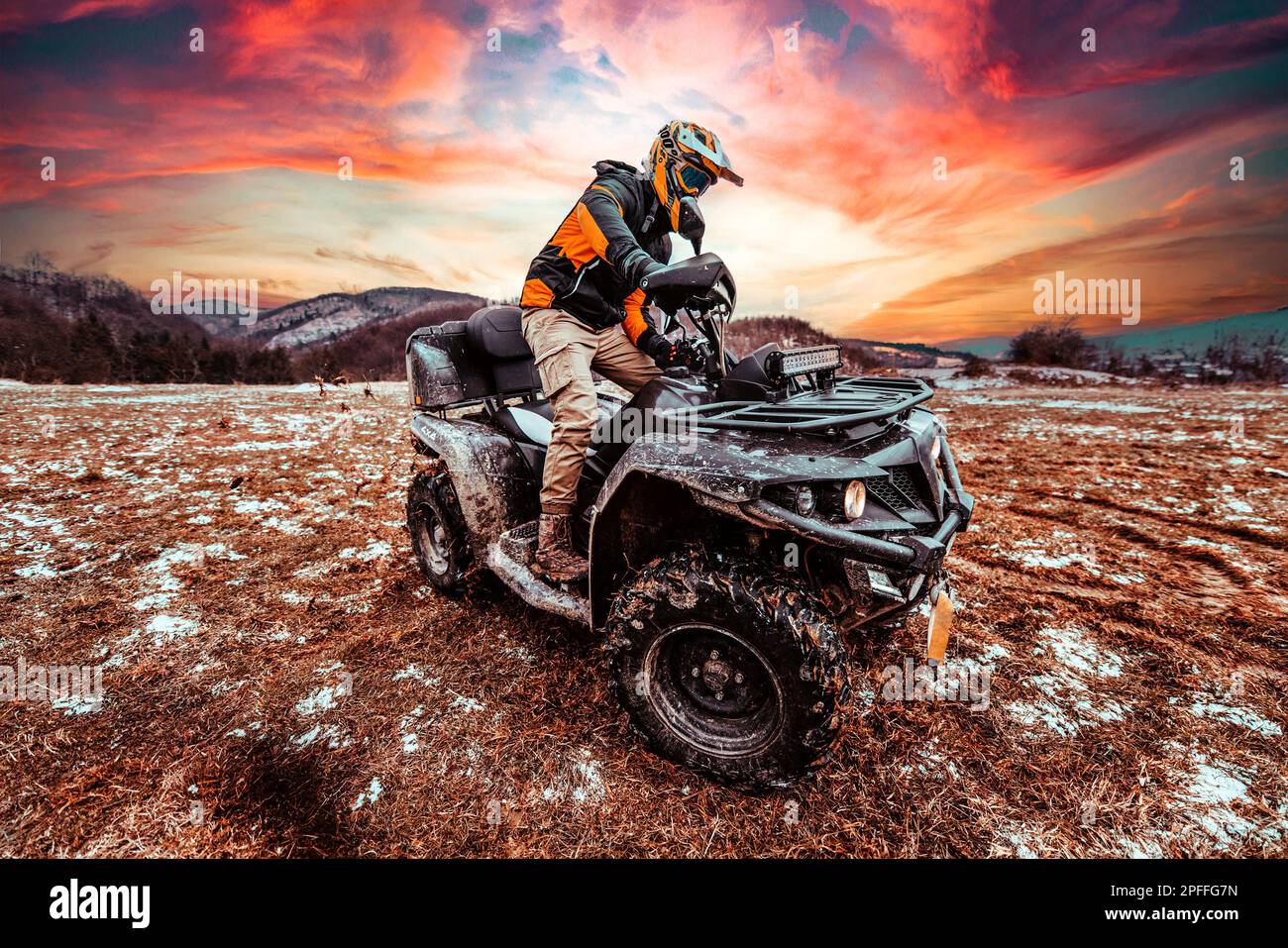 A man drives an ATV in the mud. Drift driving an ATV quad in mud and ...