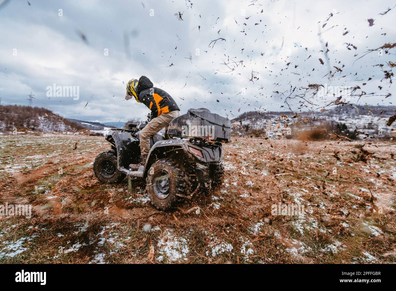 A man drives an ATV in the mud. Drift driving an ATV quad in mud and ...