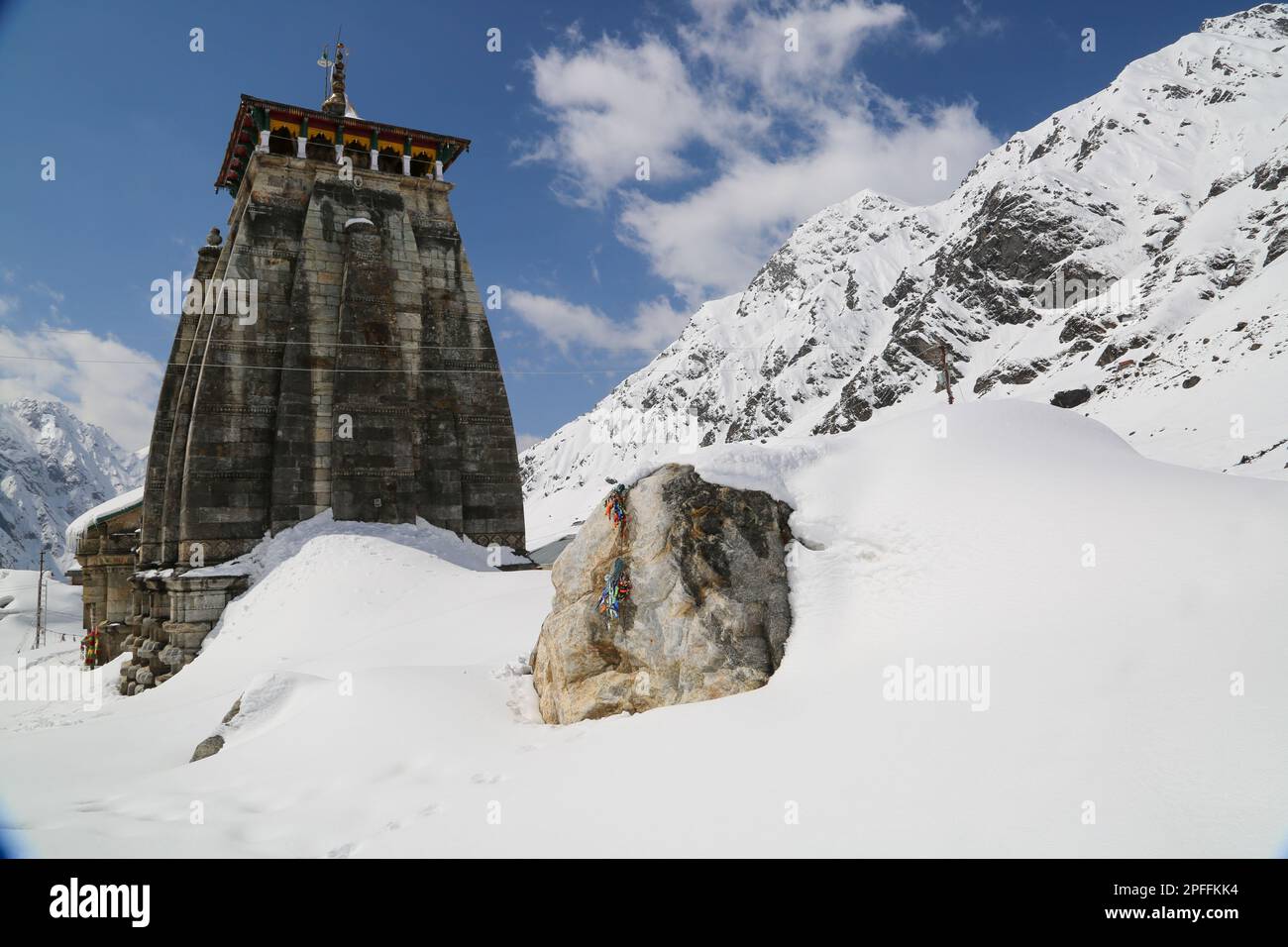 Kedarnath temple, shrine covered with snow. Kedarnath temple is a Hindu ...