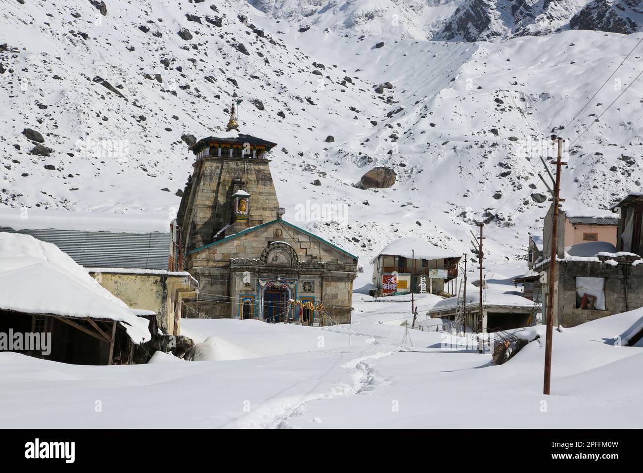 Kedarnath temple, shrine covered with snow. Kedarnath temple is a Hindu ...