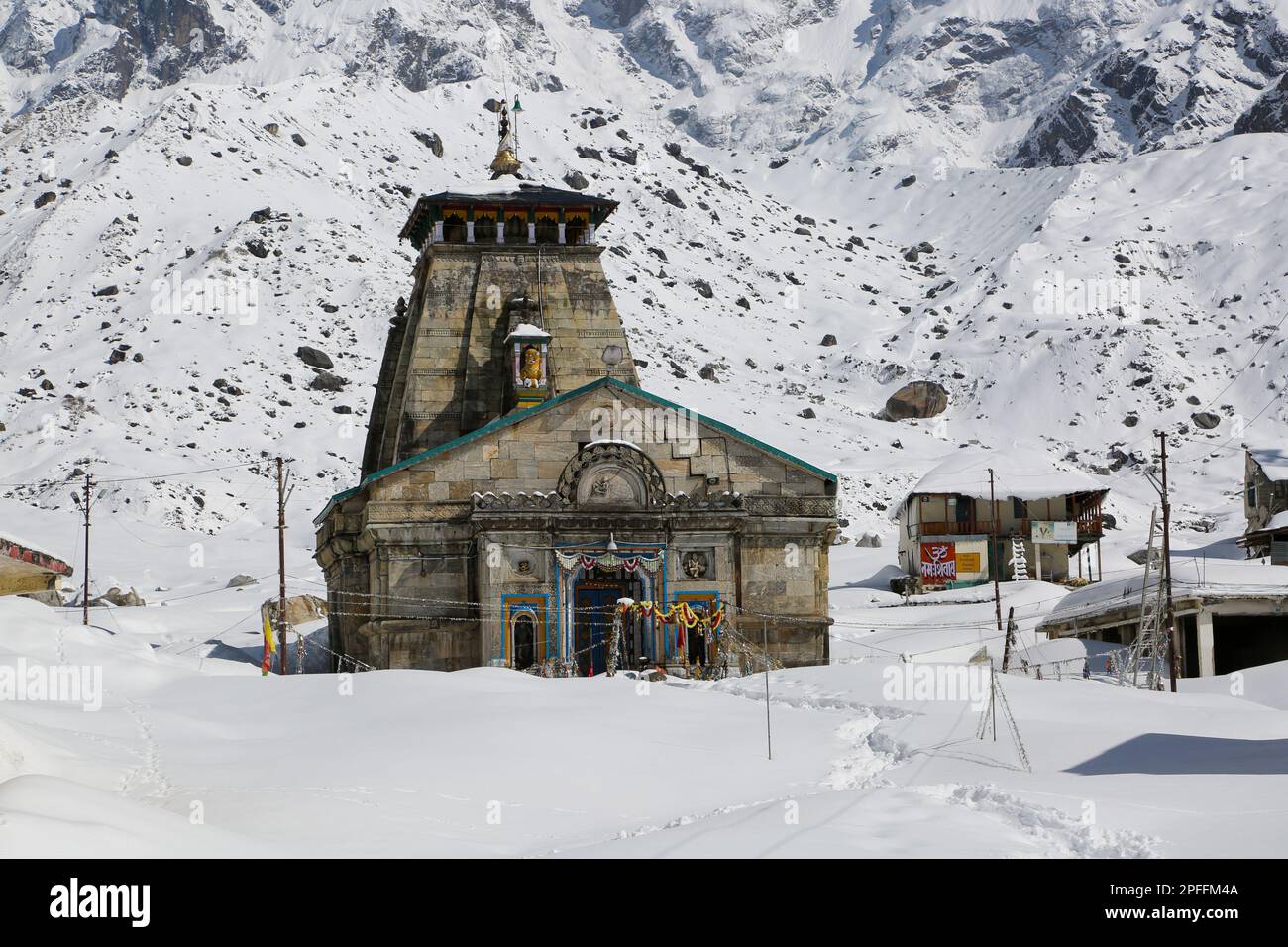 Kedarnath temple, shrine covered with snow. Kedarnath temple is a Hindu ...