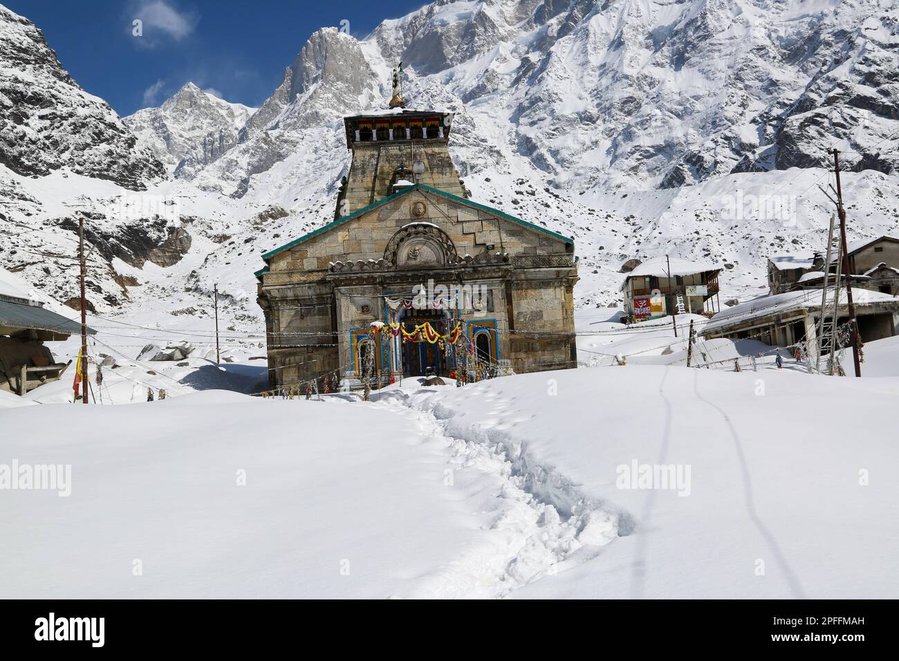 Kedarnath temple, shrine covered with snow. Kedarnath temple is a Hindu ...