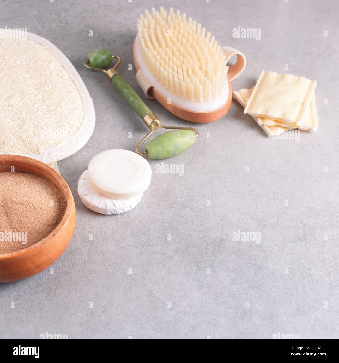 Natural bath accessories on grey stone background, square composition ...