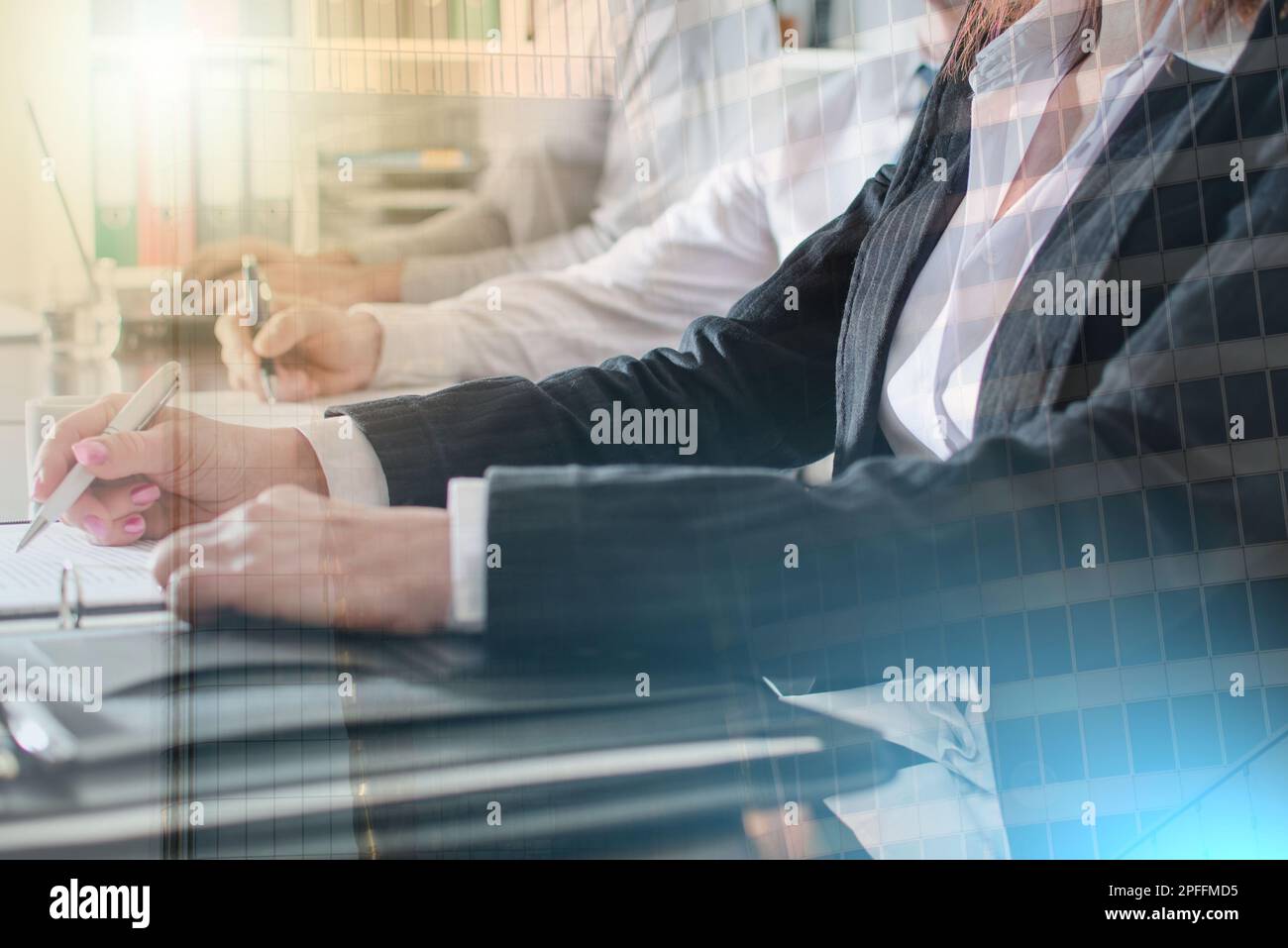 Business people taking notes during a training; multiple exposure Stock ...