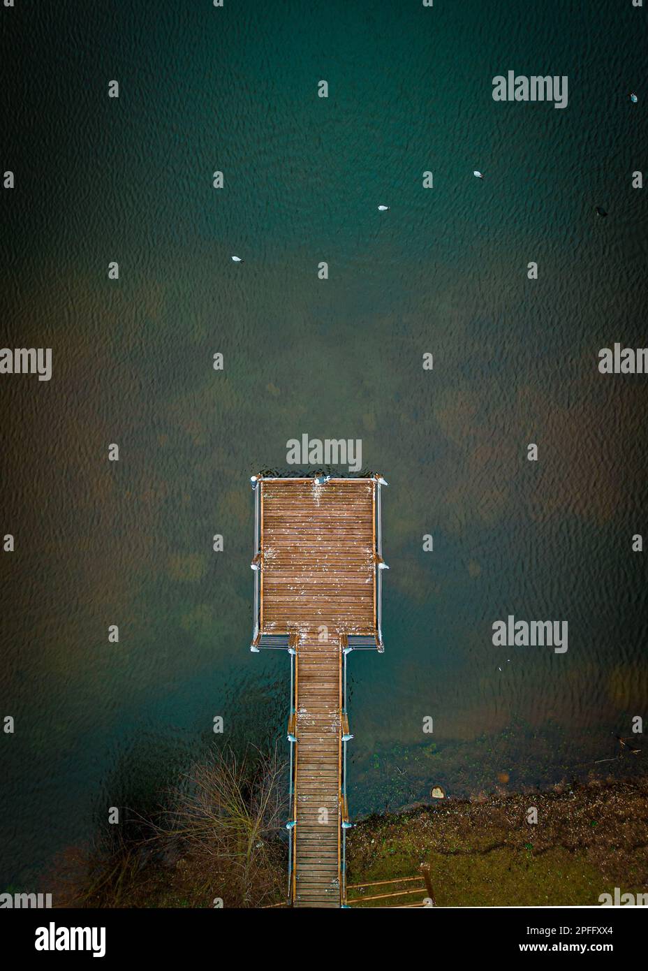 An aerial view of a picturesque dock above a blue body of water Stock ...