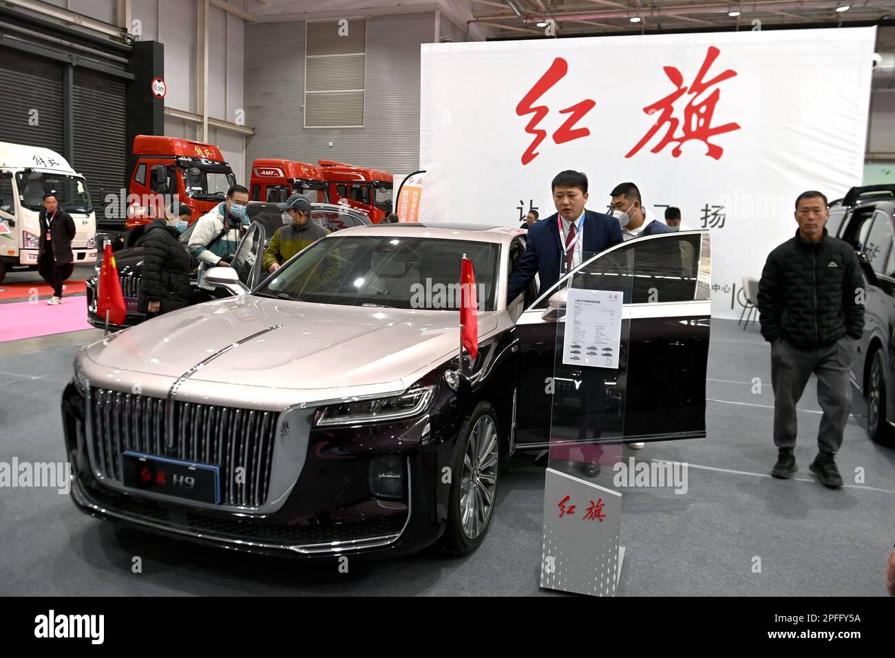 QINGDAO, CHINA - MARCH 17, 2023 - A red flag car attracts crowds of ...