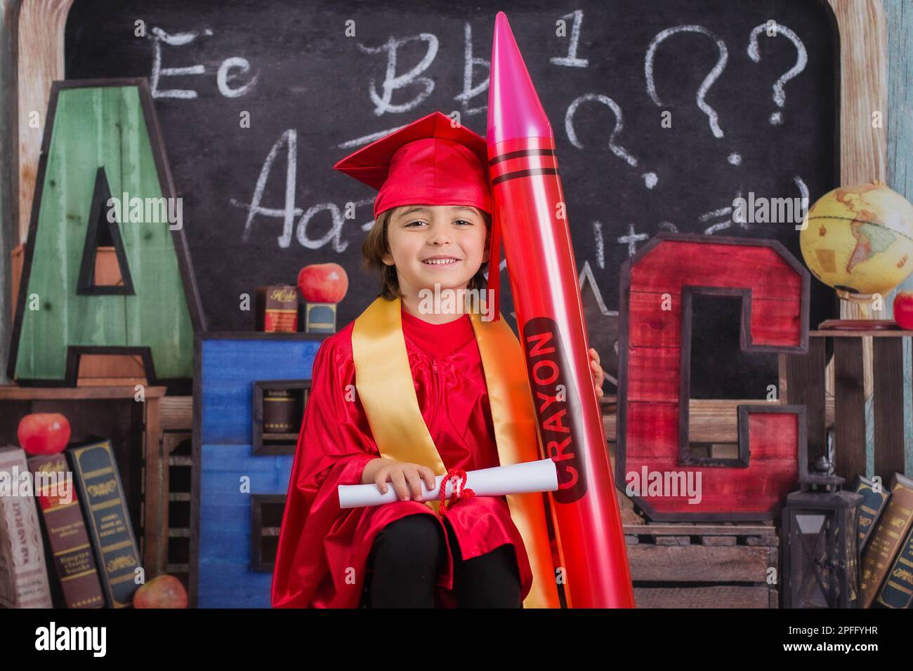 An adorable little boy proudly displaying a VPK diploma during ...