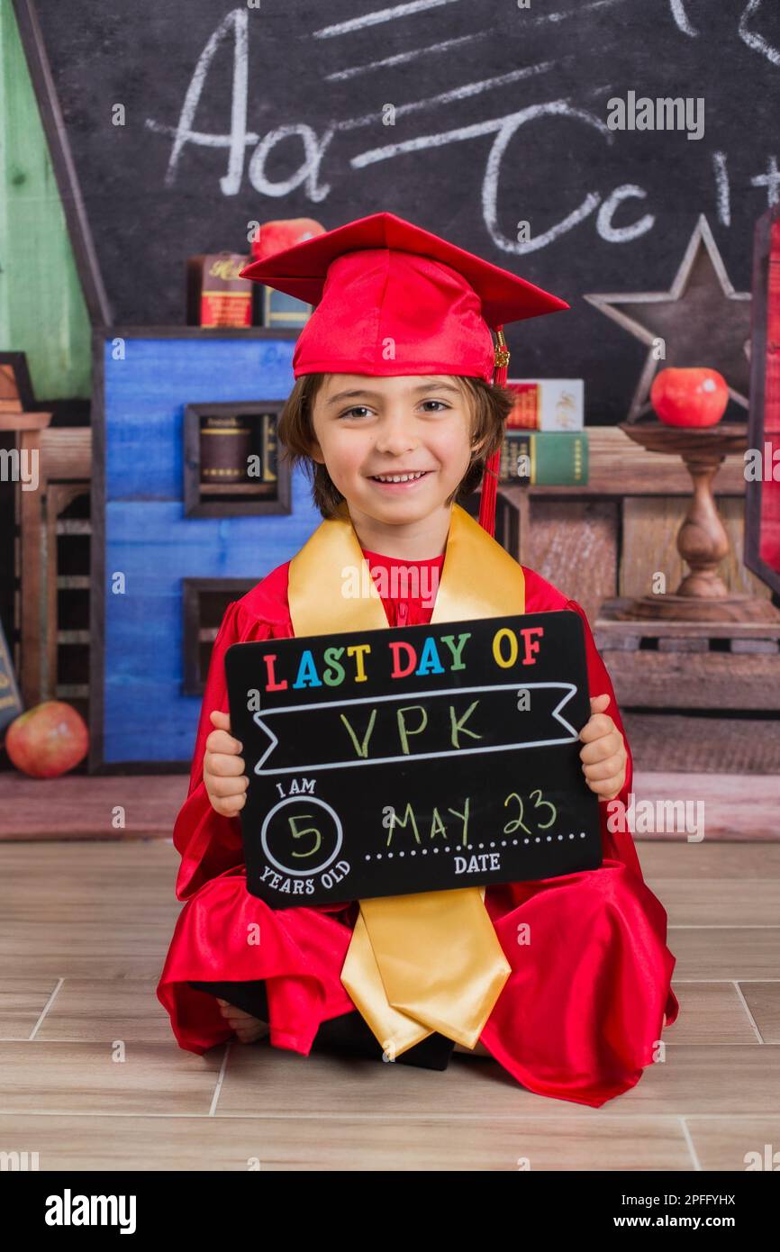 An adorable little boy holding a VPK diploma during kindergarten ...