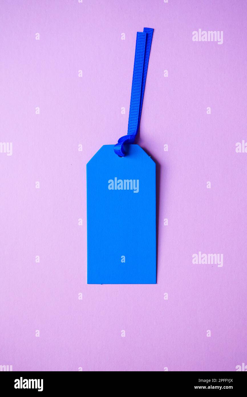 blue price tag on the pink background Stock Photo - Alamy