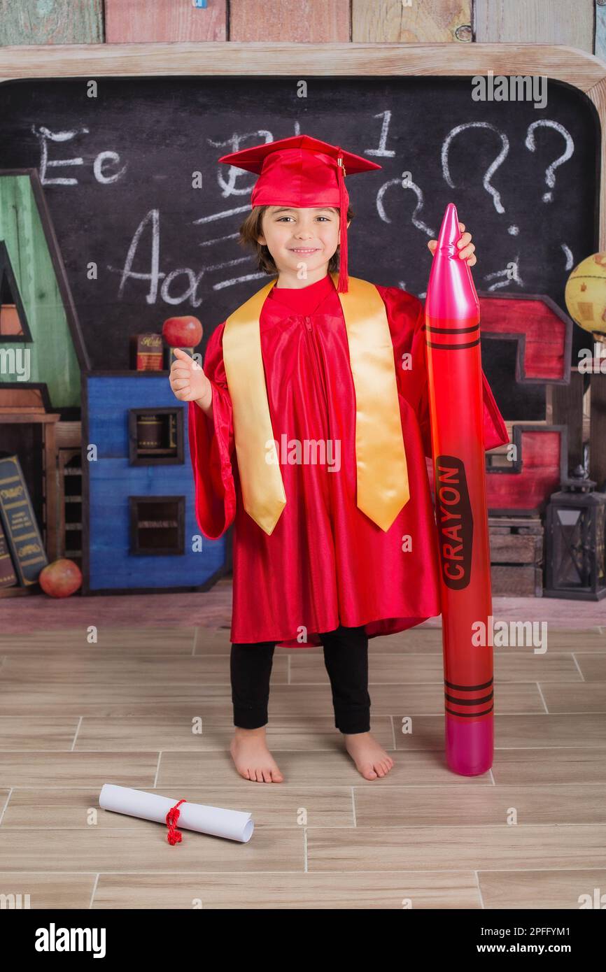 An adorable little boy with a VPK diploma during kindergarten ...