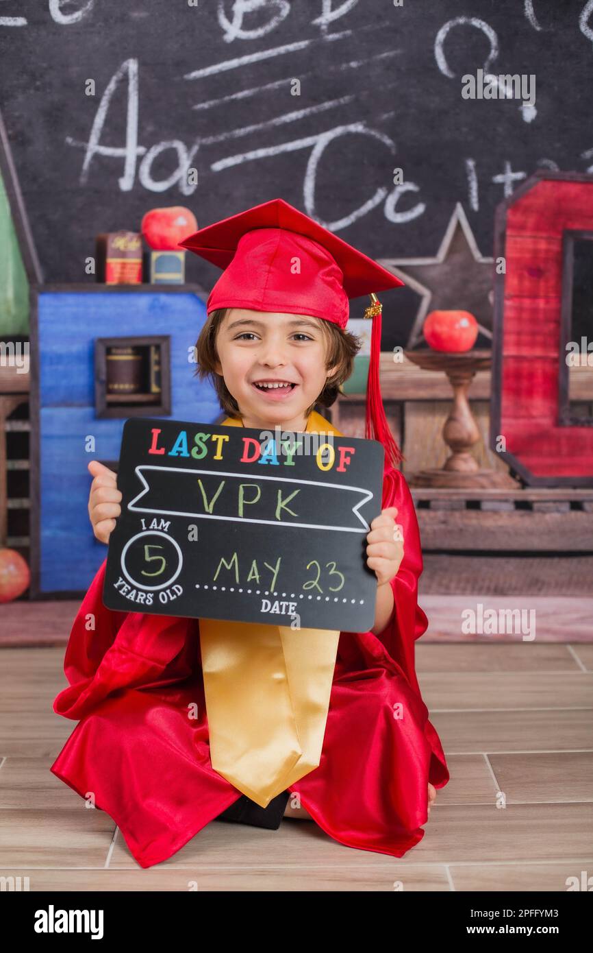 An adorable little boy holding a VPK diploma during kindergarten ...