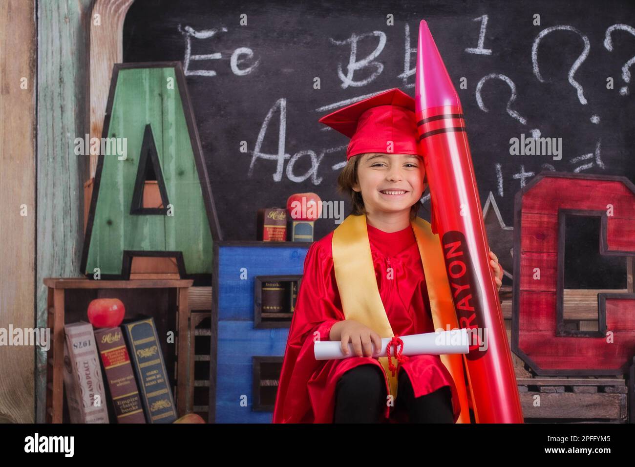 An adorable little boy proudly displaying a VPK diploma during ...