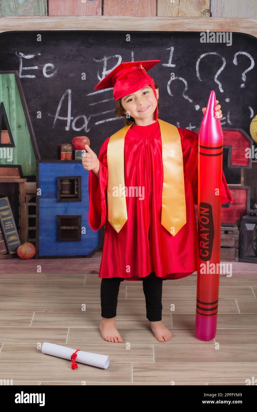 An adorable little boy with a VPK diploma during kindergarten ...