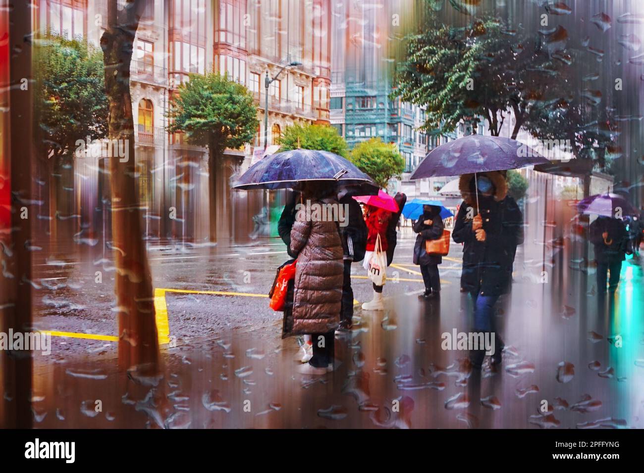 people with an umbrella in rainy days in winter season, bilbao, basque ...