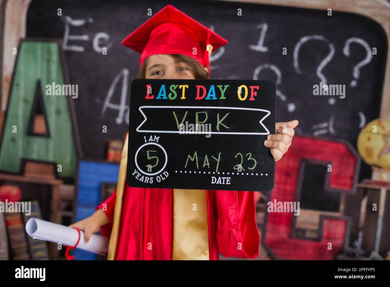An adorable little boy holding a VPK diploma during kindergarten ...