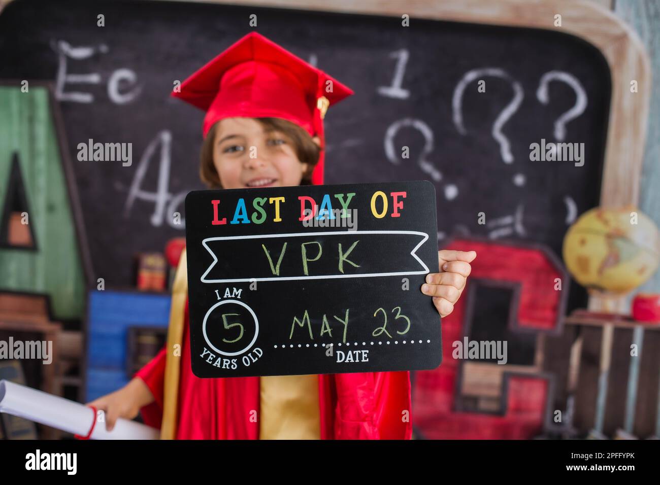 An adorable little boy holding a VPK diploma during kindergarten ...