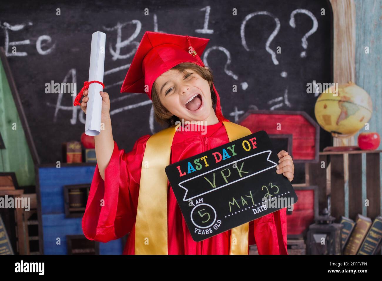 An adorable little boy holding a VPK diploma during kindergarten ...