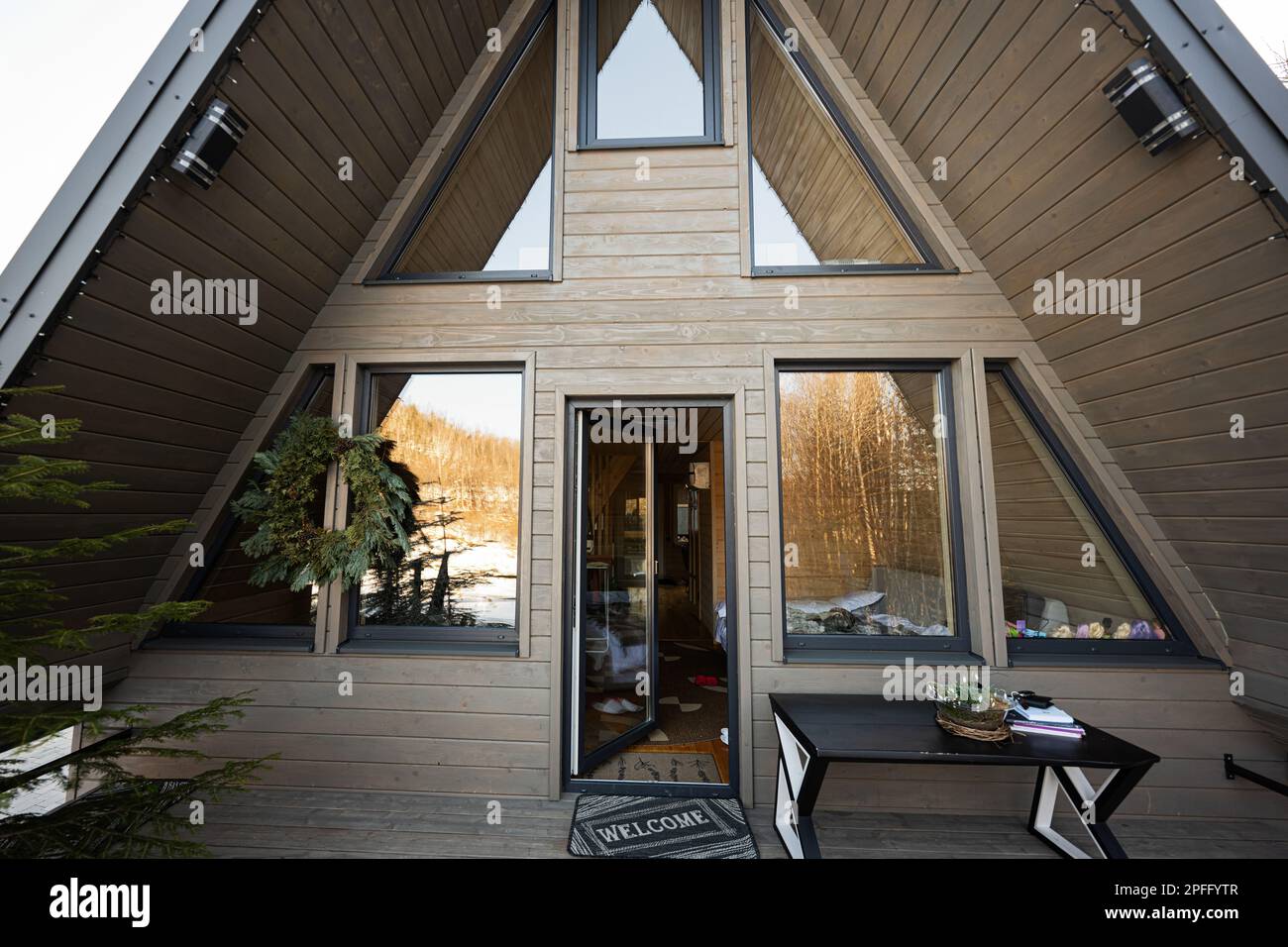 Triangle off grid tiny house in the mountains Stock Photo - Alamy