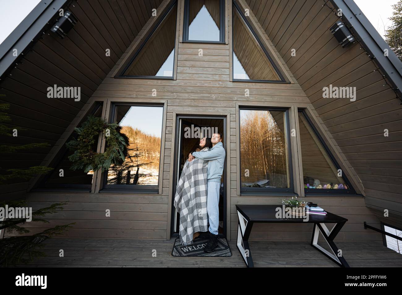 Couple in love on terrace off grid tiny house in the mountains Stock ...