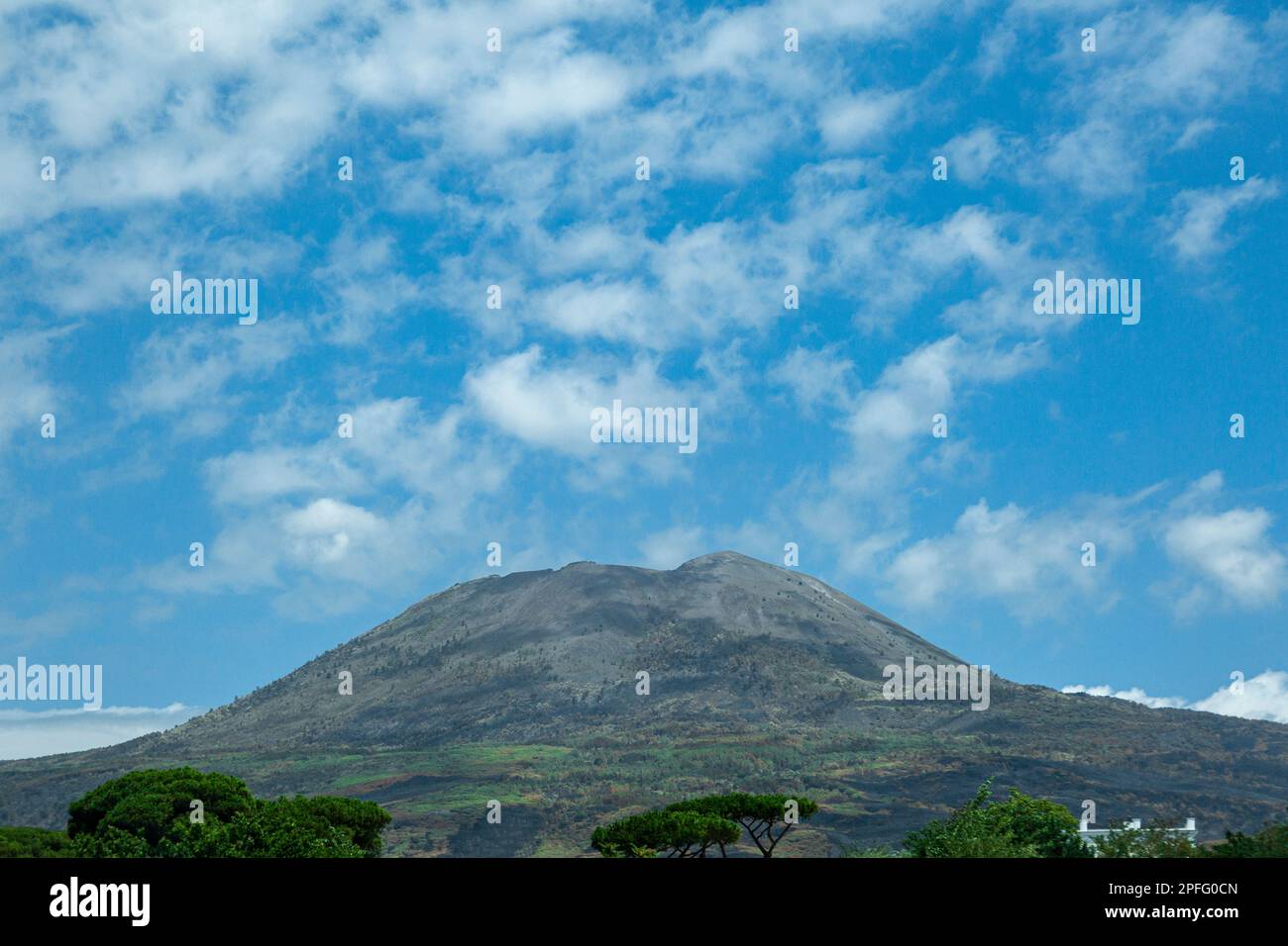 A mountain Vesuvius with a blue sky and clouds - is a somma ...