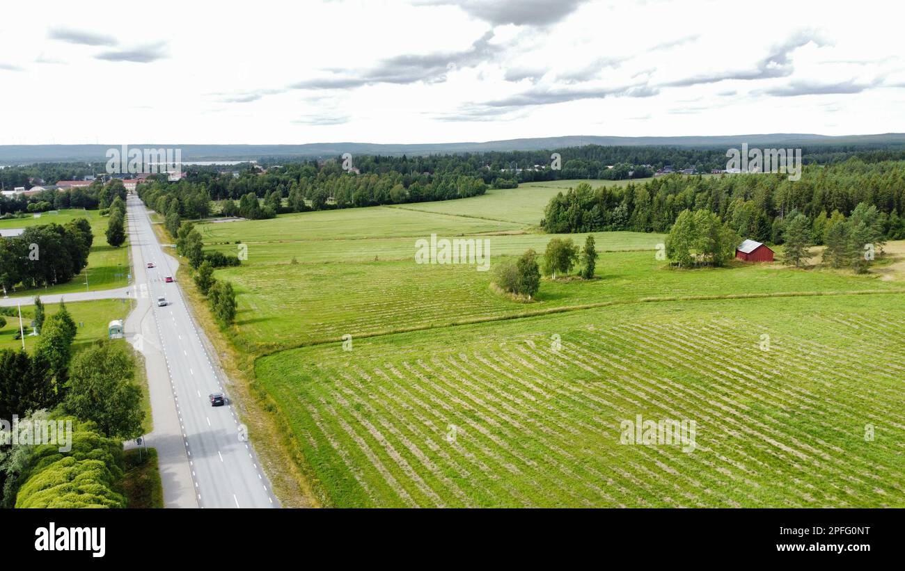 Aerial view of rural landscape with green trees and a highway road ...