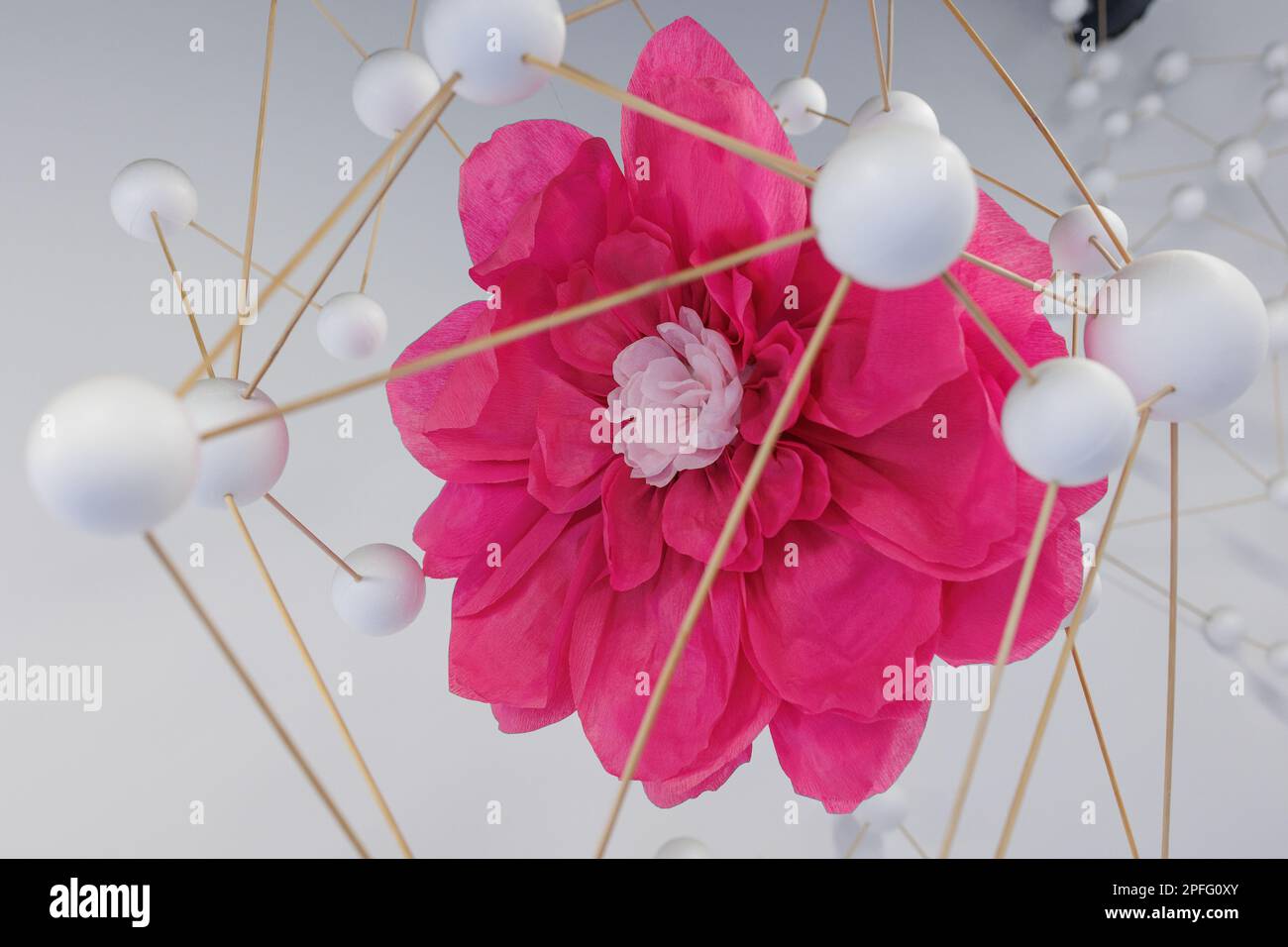 Artistic Depiction of a Pink Flower in Crepe Paper surrounded by a ...