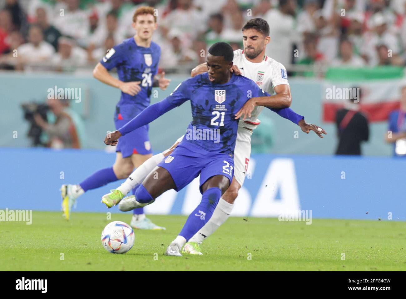 Timothy Weah of USA (L) and Milad Mohammadi (R) of Iran in action ...
