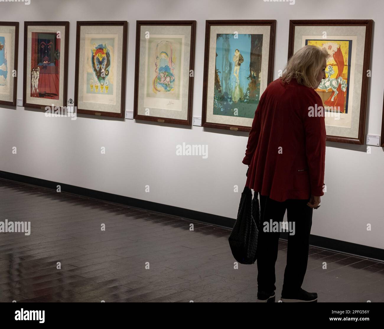 Miami, United States. 16th Mar, 2023. A women looks at the art work of ...