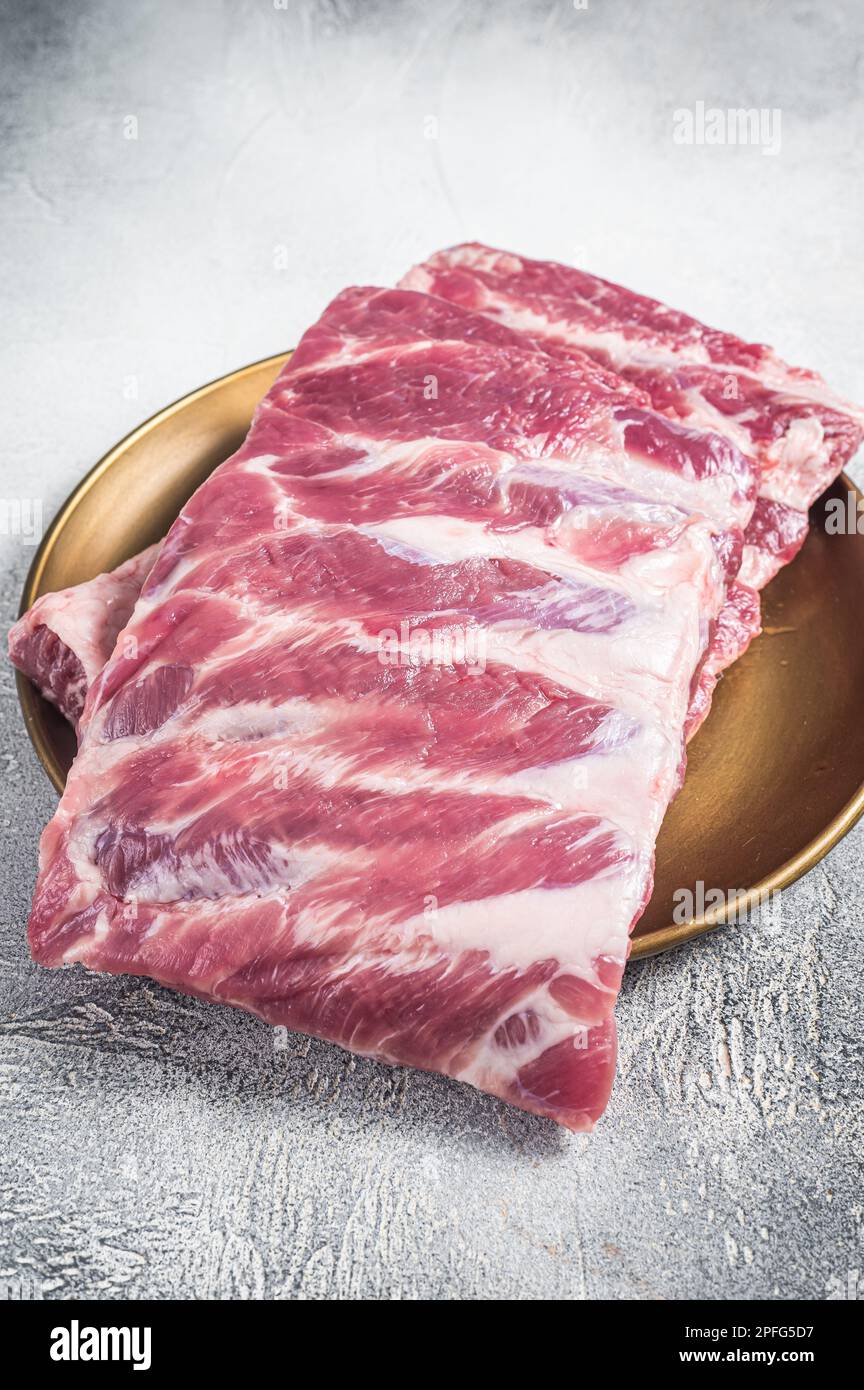 Rack of raw pork spare ribs. White background. Top view Stock Photo - Alamy