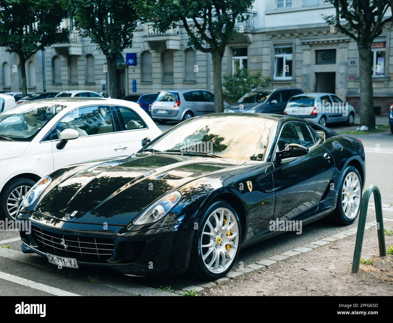 Paris, Fnance - Jun 27, 2015: A sleek black Ferrari sports car parked ...