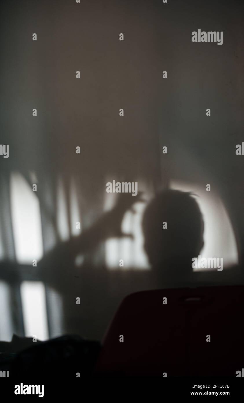 Woman shadow wall eerie hi-res stock photography and images - Alamy