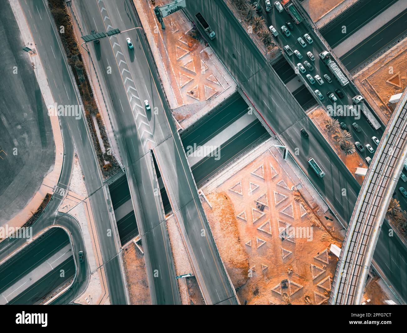 An aerial view of a busy urban street, with multiple lanes of traffic ...
