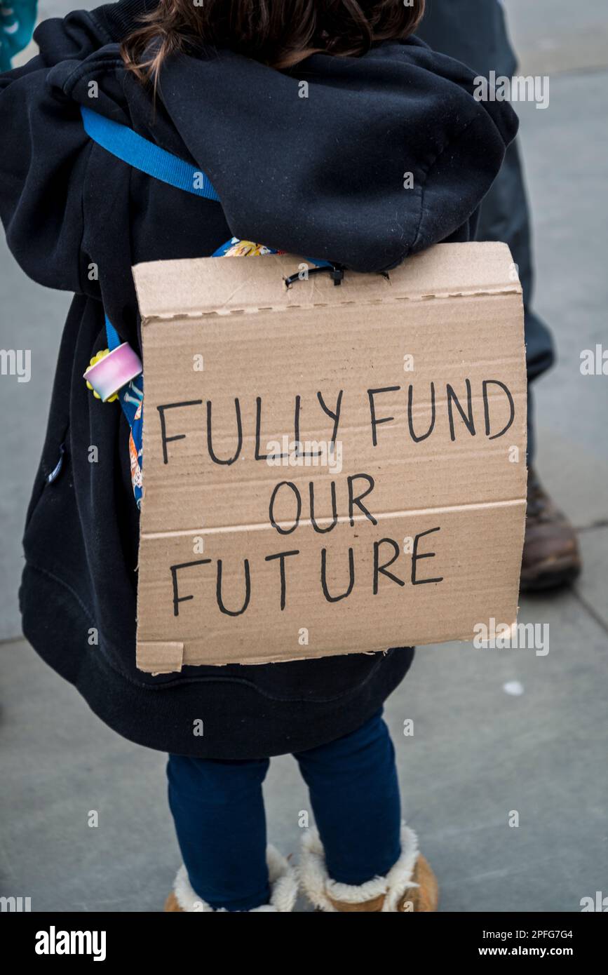 Child carrying placard 'Fully fund our future', Teachers strike and ...