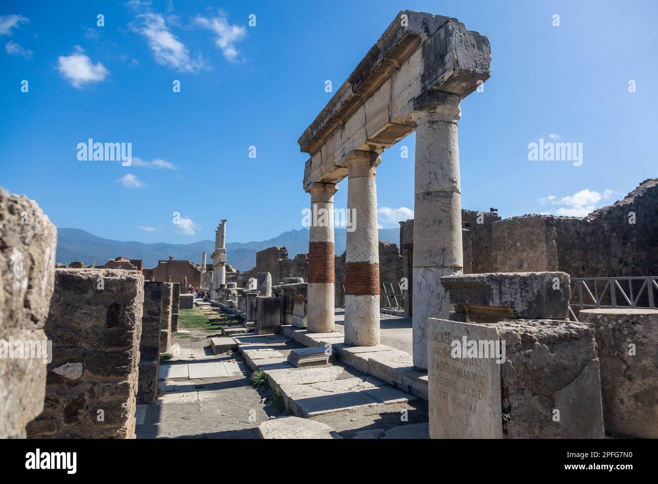 A street scene with columns and the words Pompeii on the left, the ...