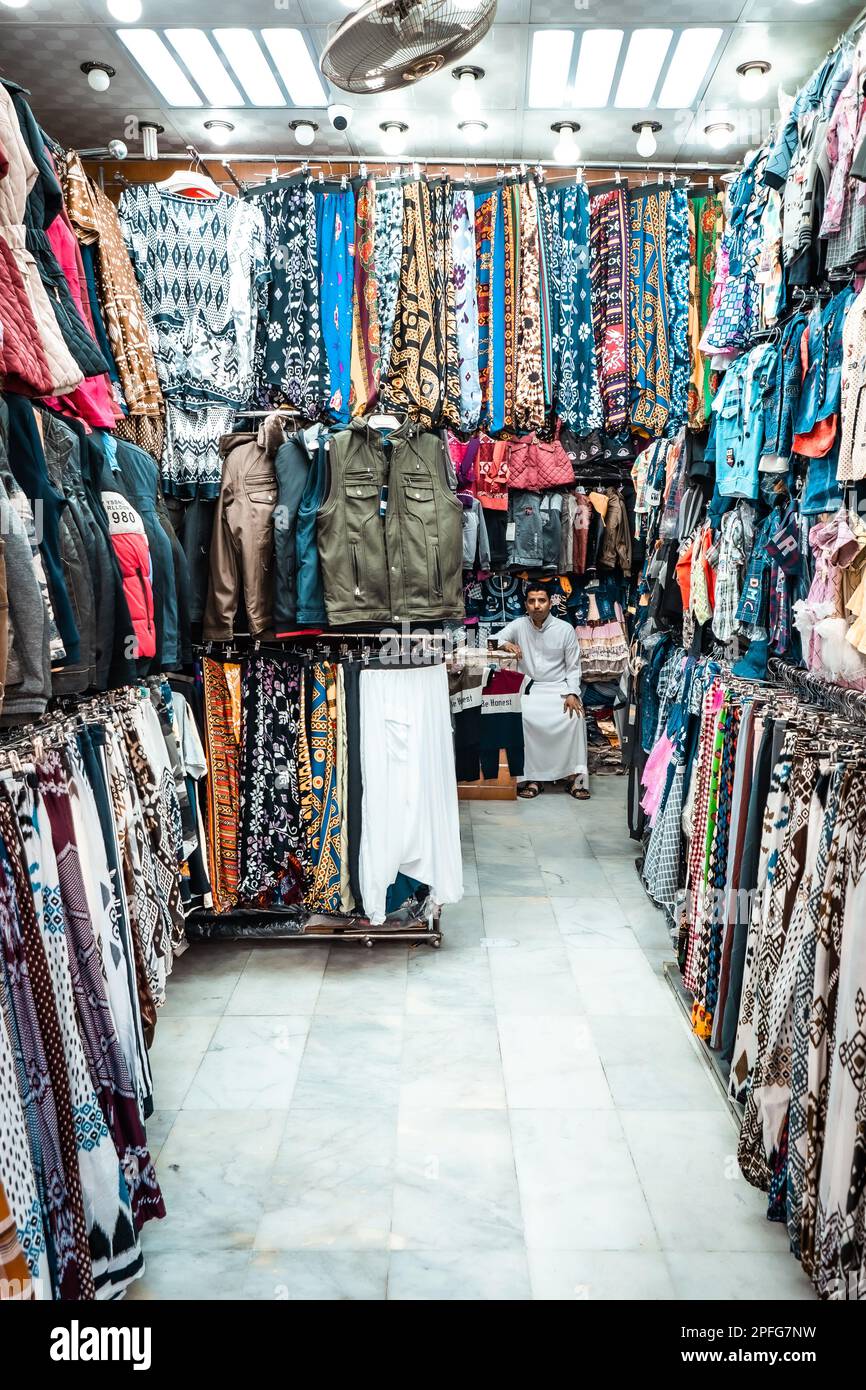 Portrait of proud textiles salesman in his shop at Souk Baab Makkah ...