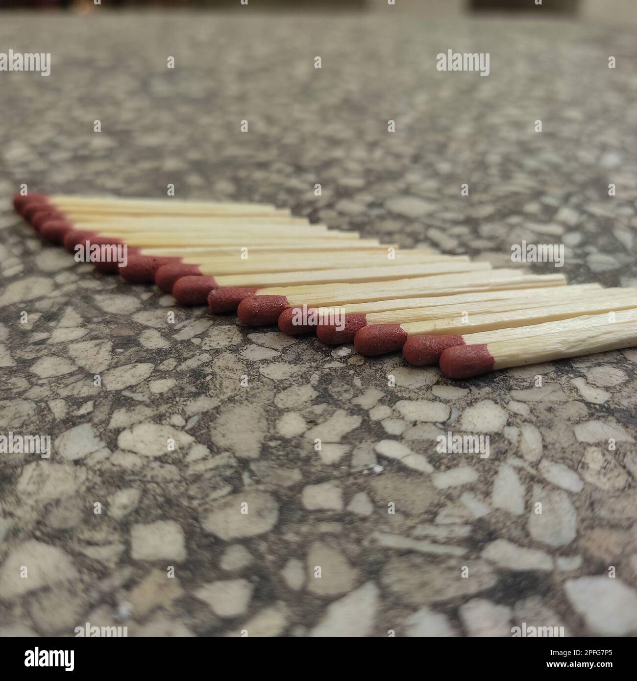Close up of open single cardboard match box on granite stone background ...