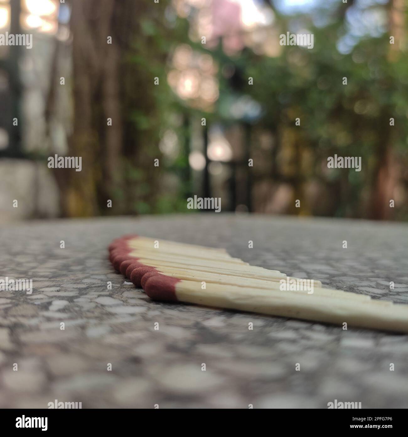 Close up of open single cardboard match box on granite stone background ...