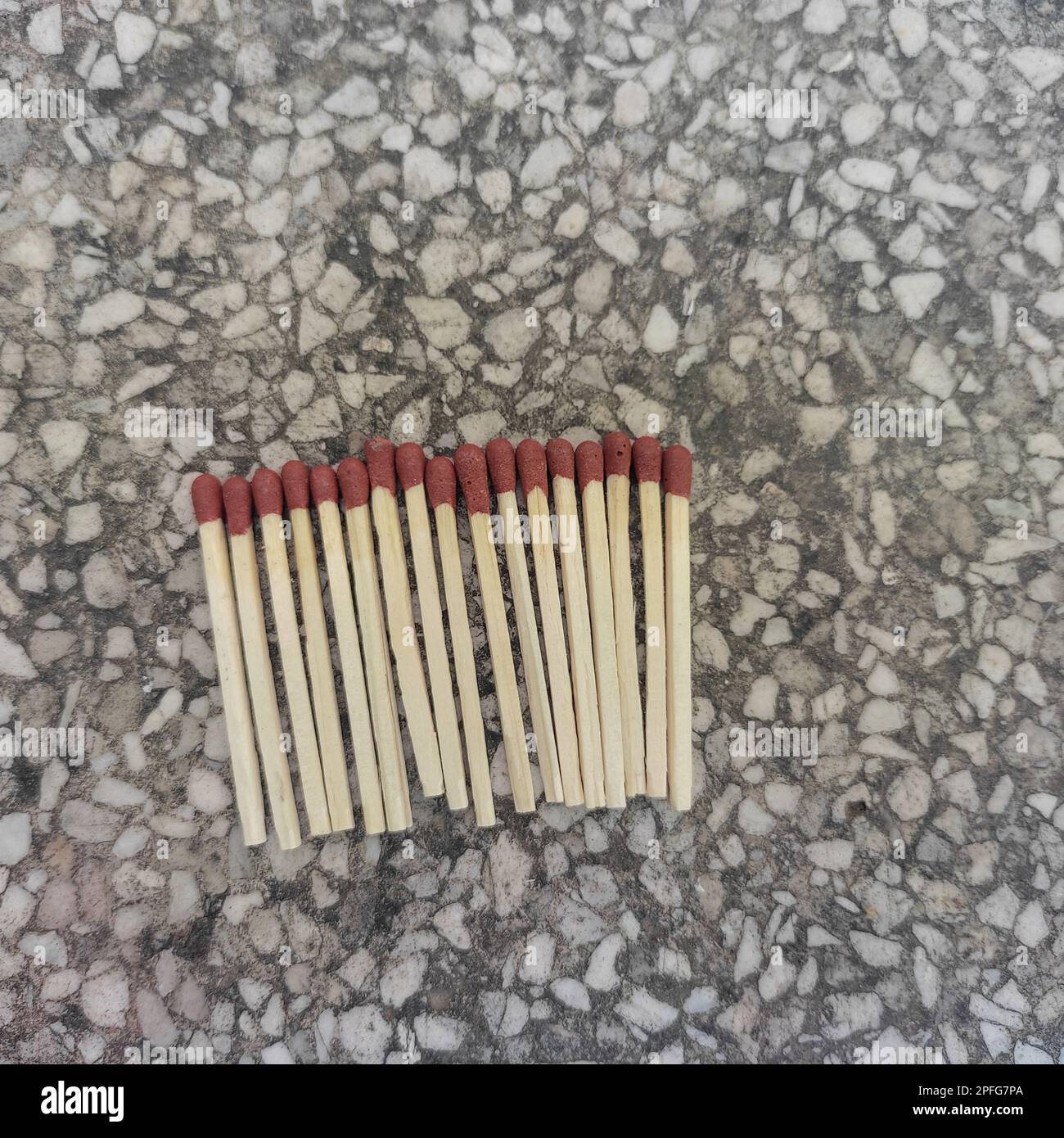 Close up of open single cardboard match box on granite stone background ...