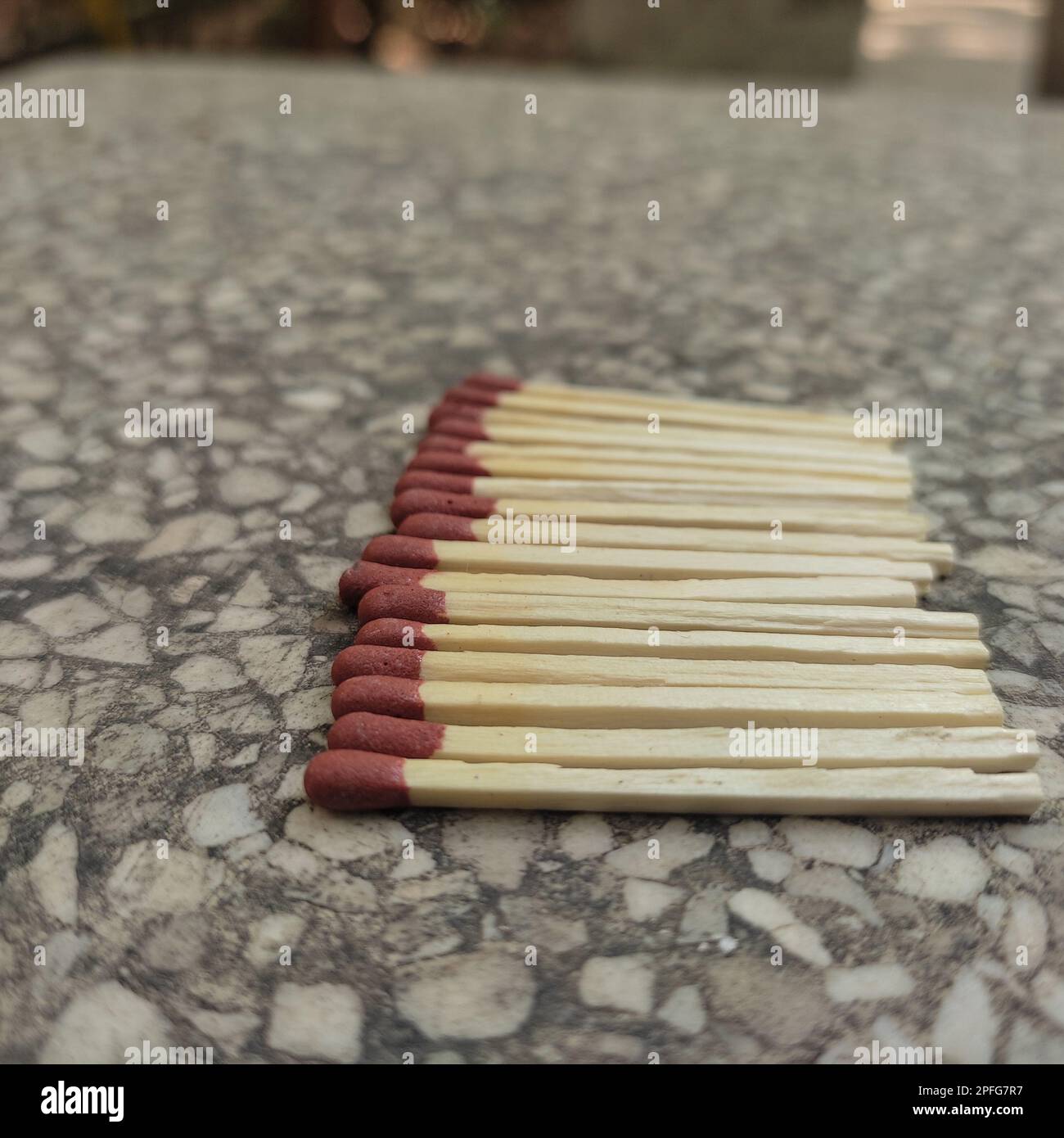 Close up of open single cardboard match box on granite stone background ...