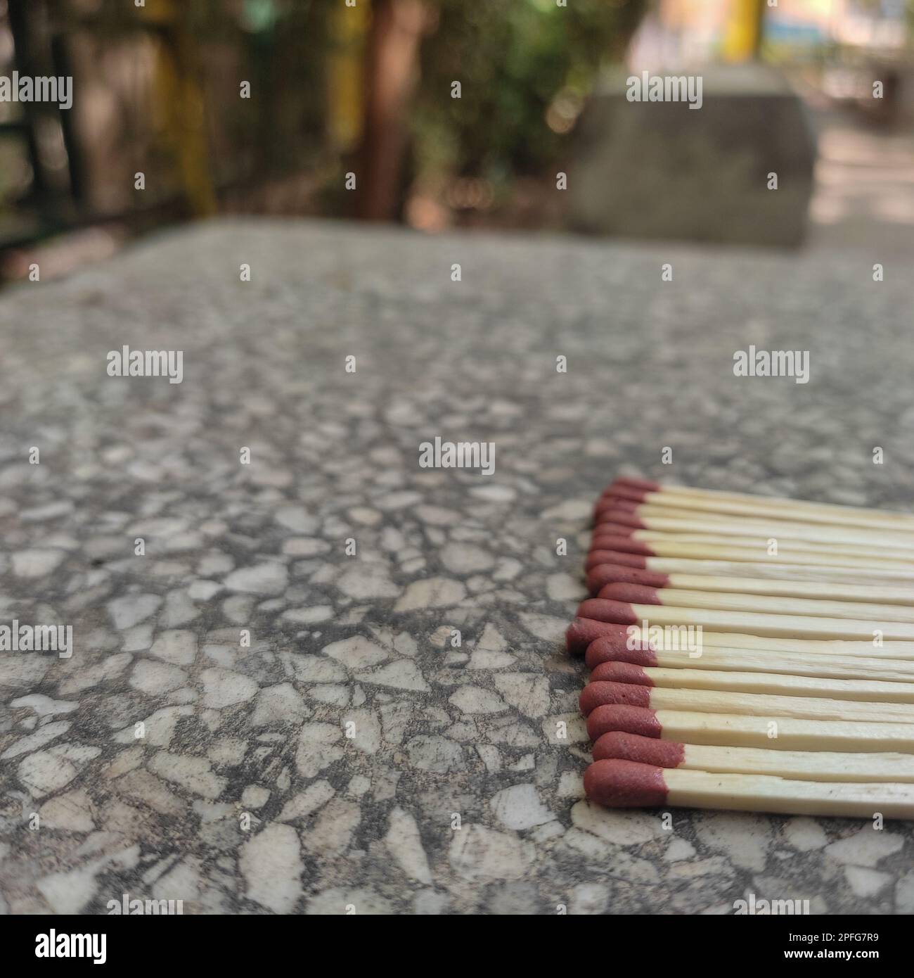 Close up of open single cardboard match box on granite stone background ...