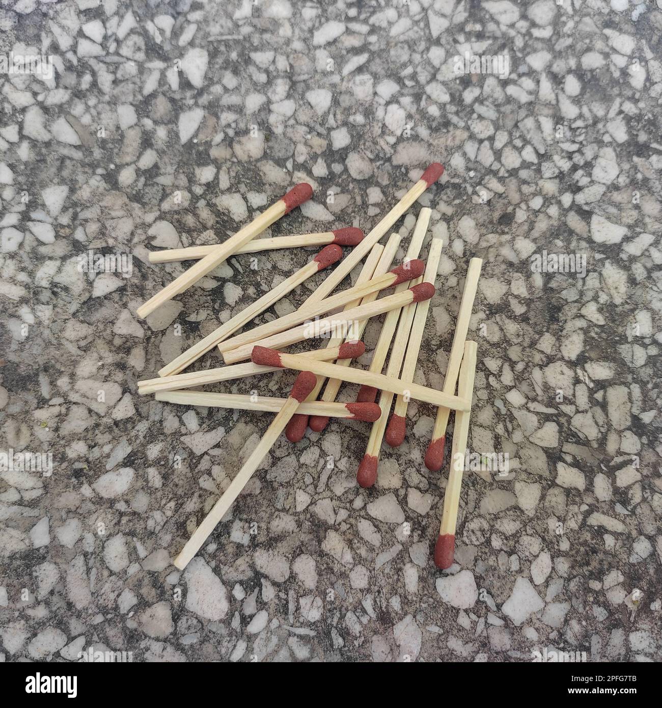 Close up of open single cardboard match box on granite stone background ...