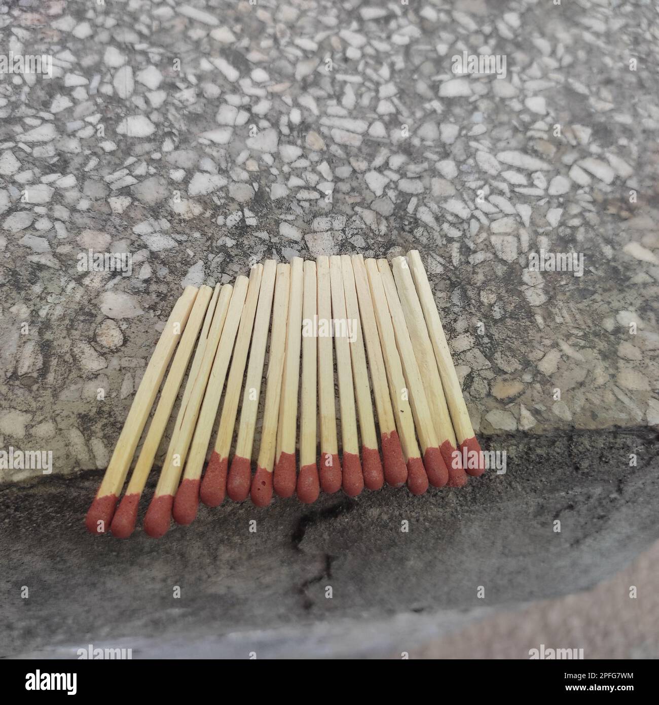 Close up of open single cardboard match box on granite stone background ...