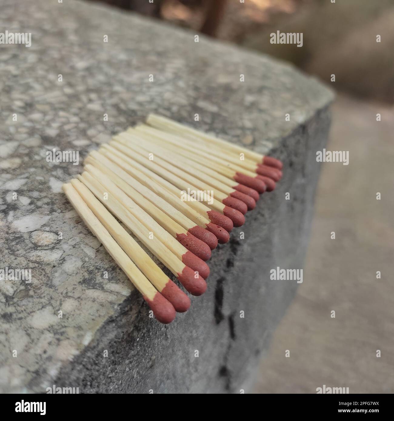 Close up of open single cardboard match box on granite stone background ...