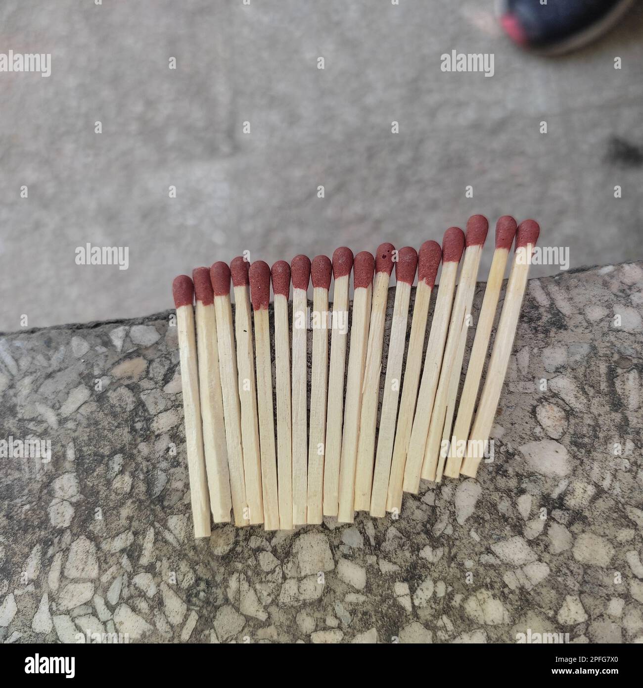 Close up of open single cardboard match box on granite stone background ...
