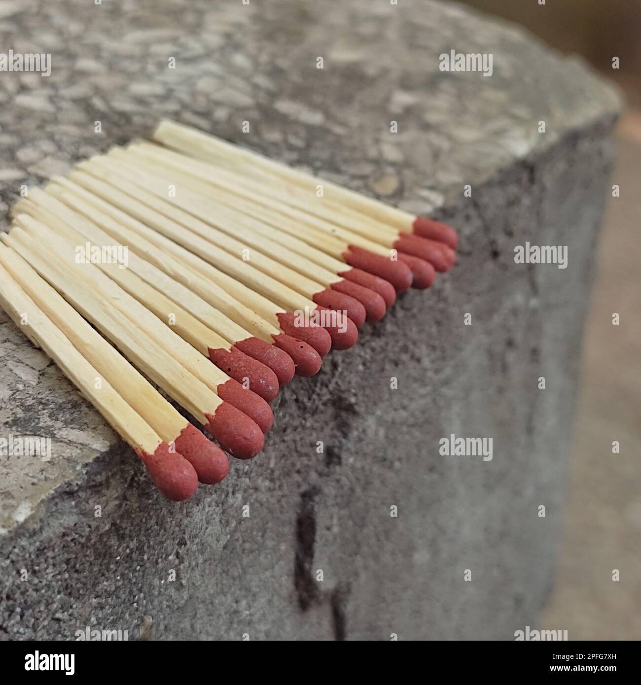Close up of open single cardboard match box on granite stone background ...