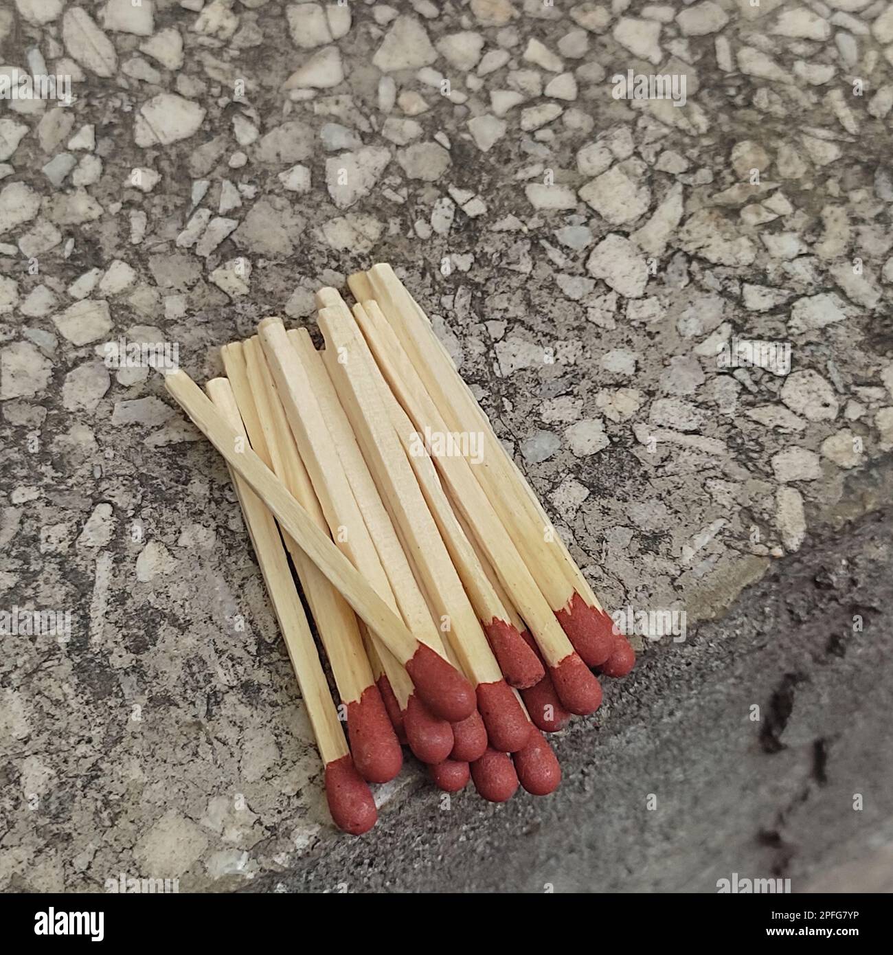 Close up of open single cardboard match box on granite stone background ...